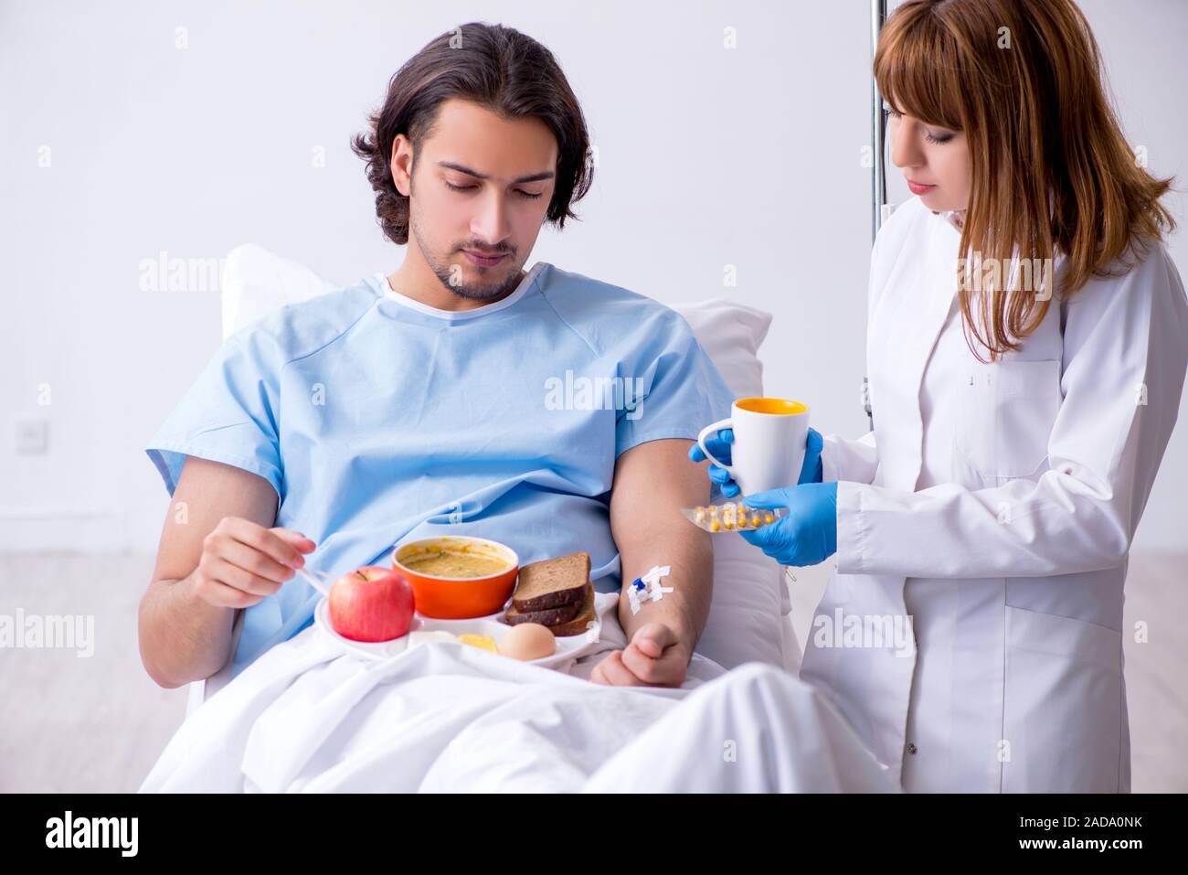 Male patient eating food in the hospital Stock Photo - Alamy
