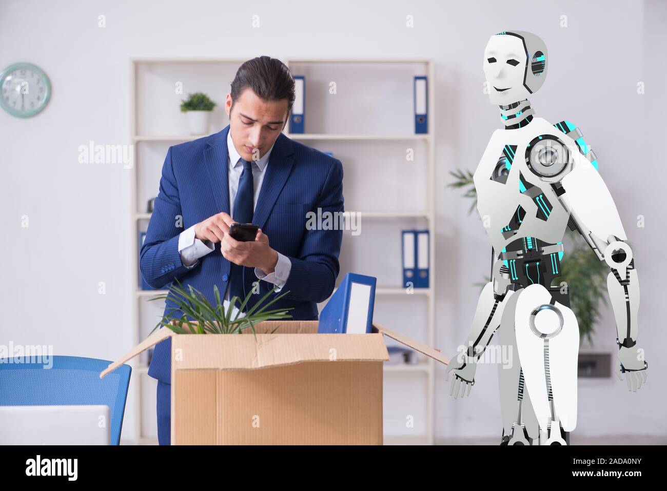Concept of robots replacing humans in offices Stock Photo - Alamy