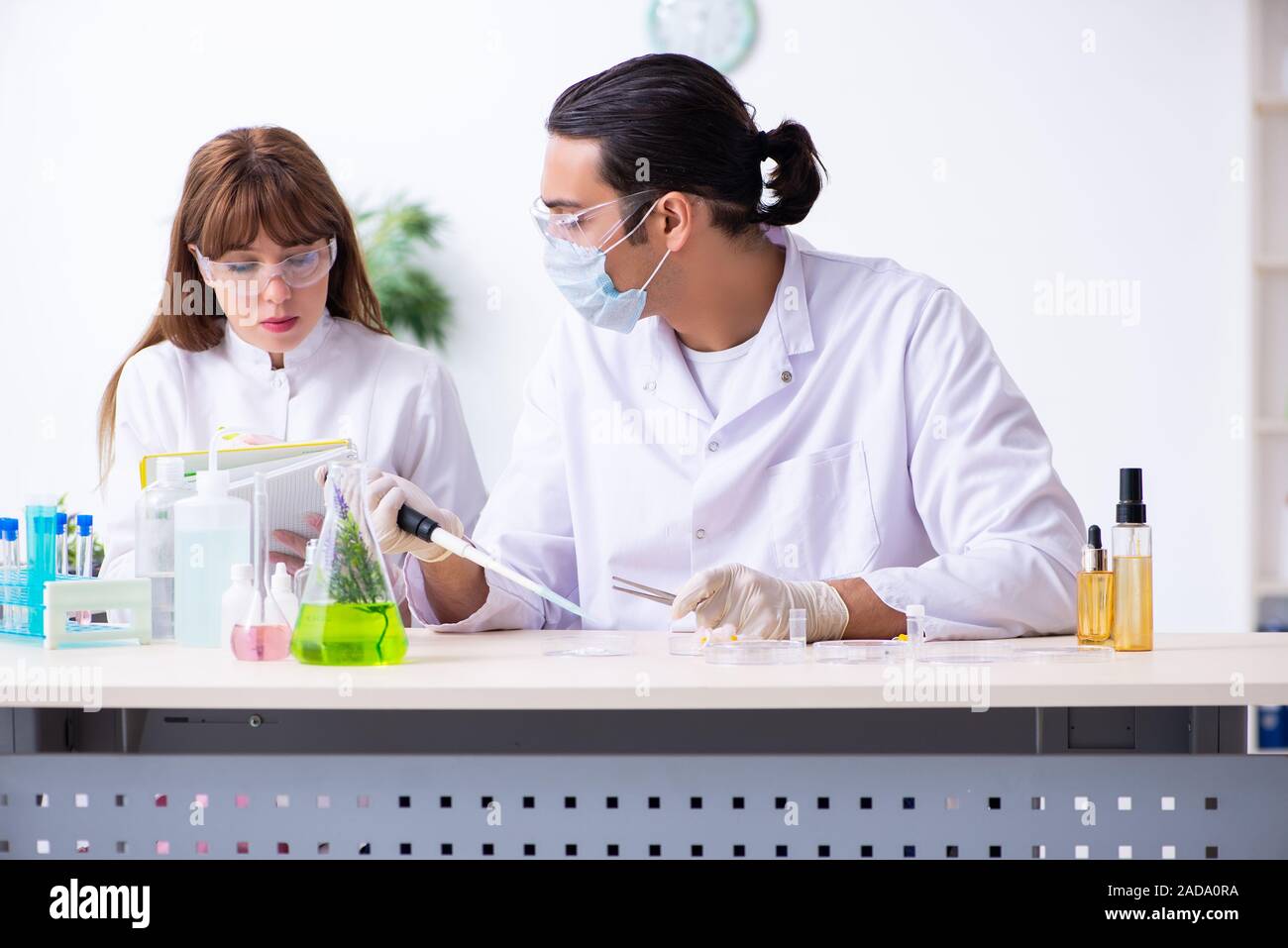 Two chemists working in the lab Stock Photo - Alamy