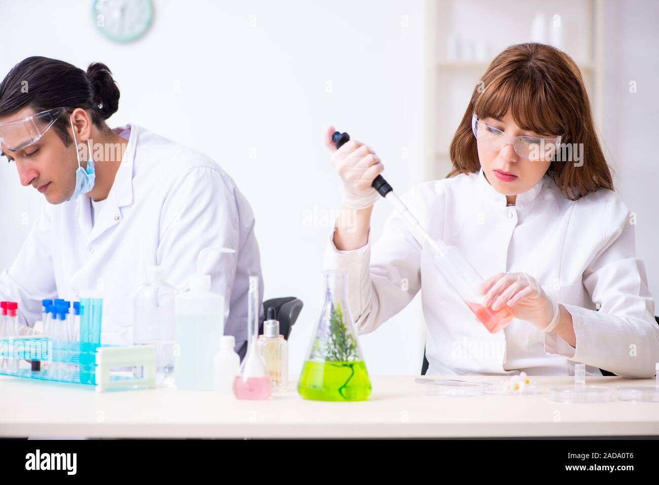 Two chemists working in the lab Stock Photo - Alamy