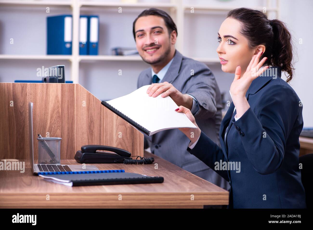 Two employees working in the office Stock Photo - Alamy