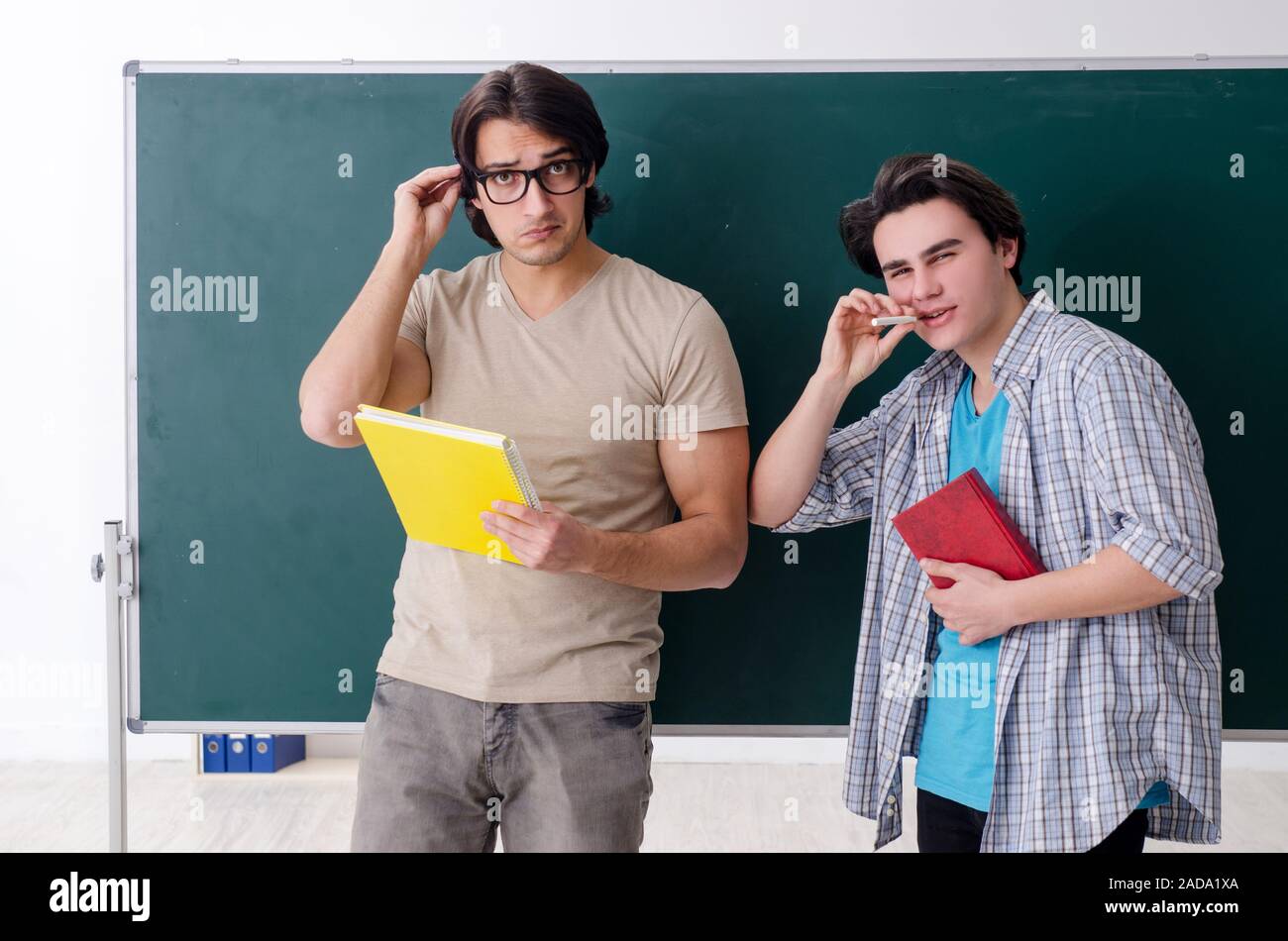 Two male students in the classroom Stock Photo - Alamy