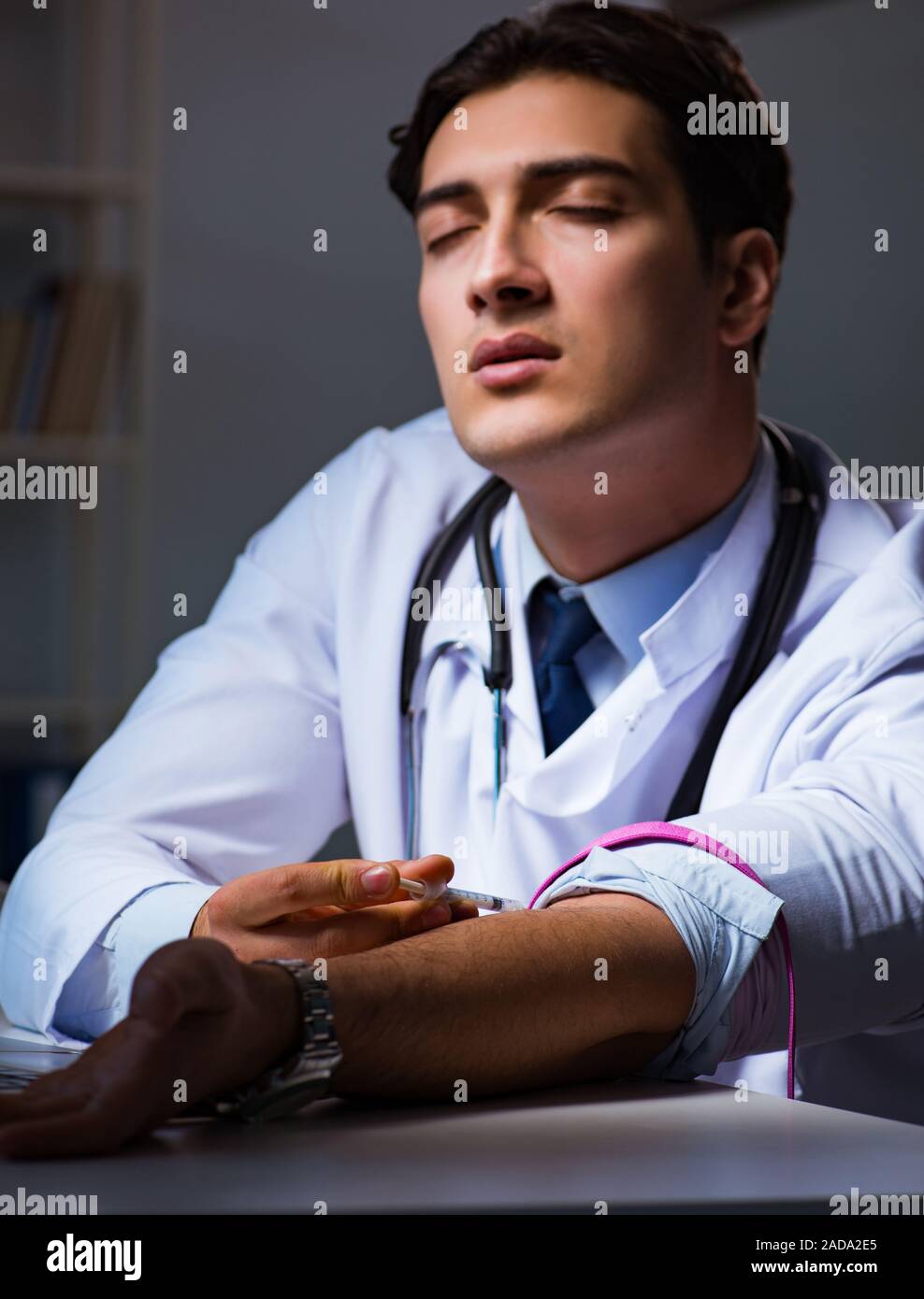 Doctor drug addict staying late on hospital Stock Photo - Alamy