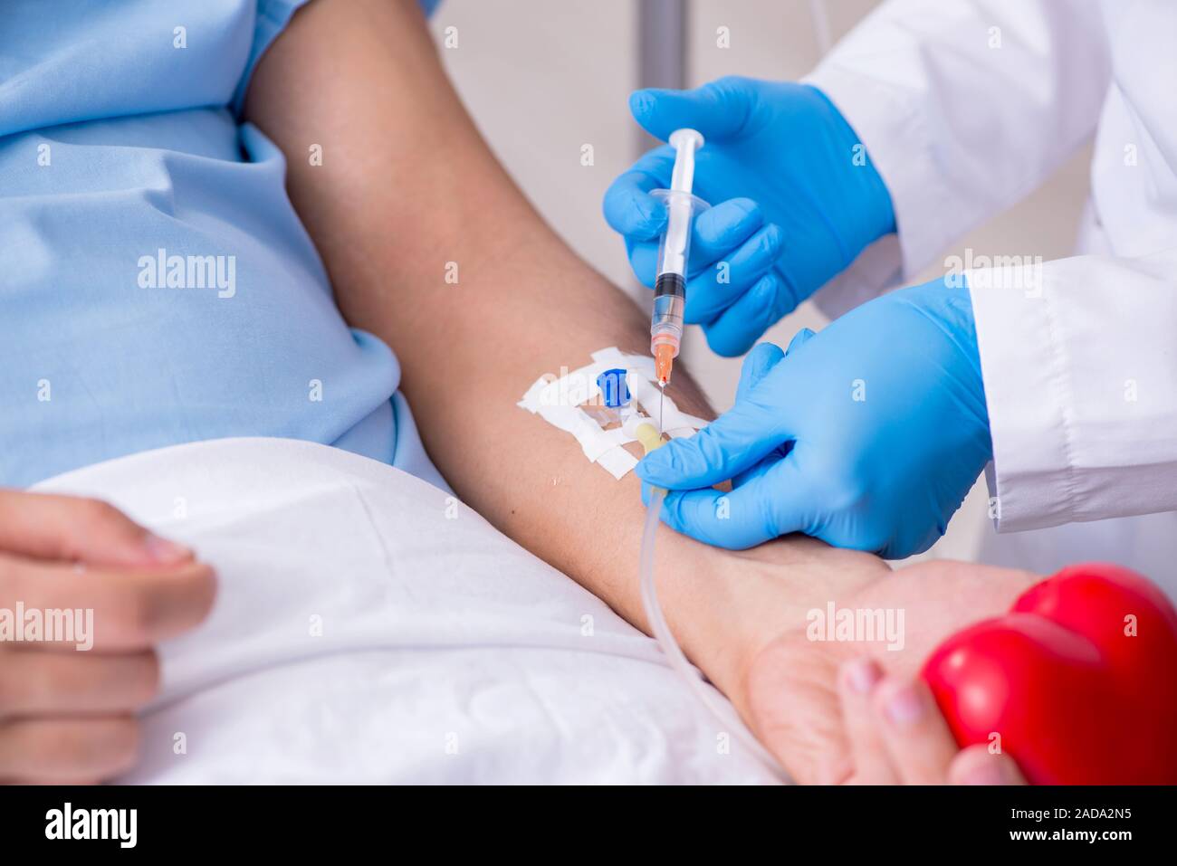 Male patient getting blood transfusion in hospital clinic Stock Photo ...