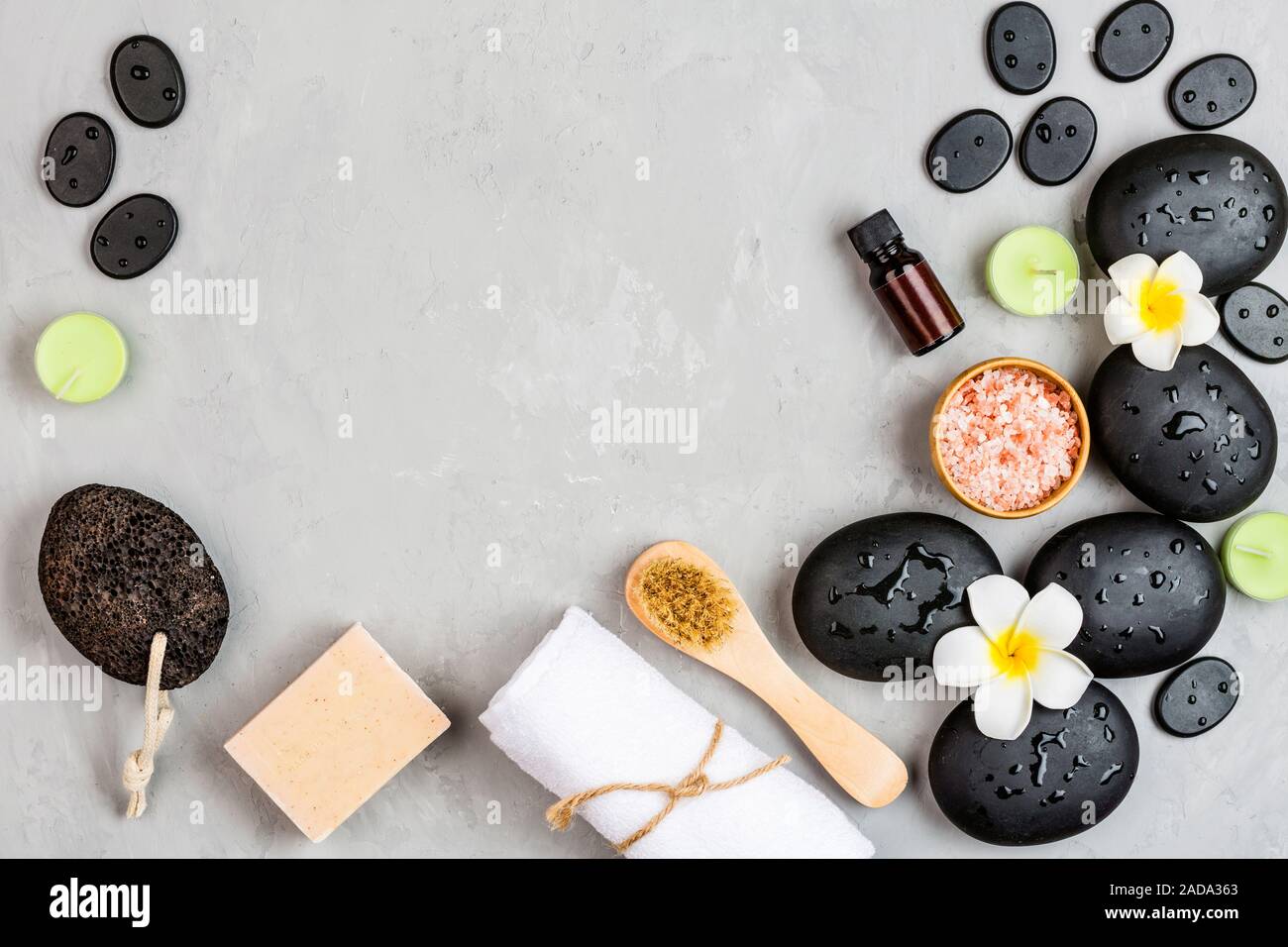 Top view of hot spa stones set for massage treatment and bamboo on ...