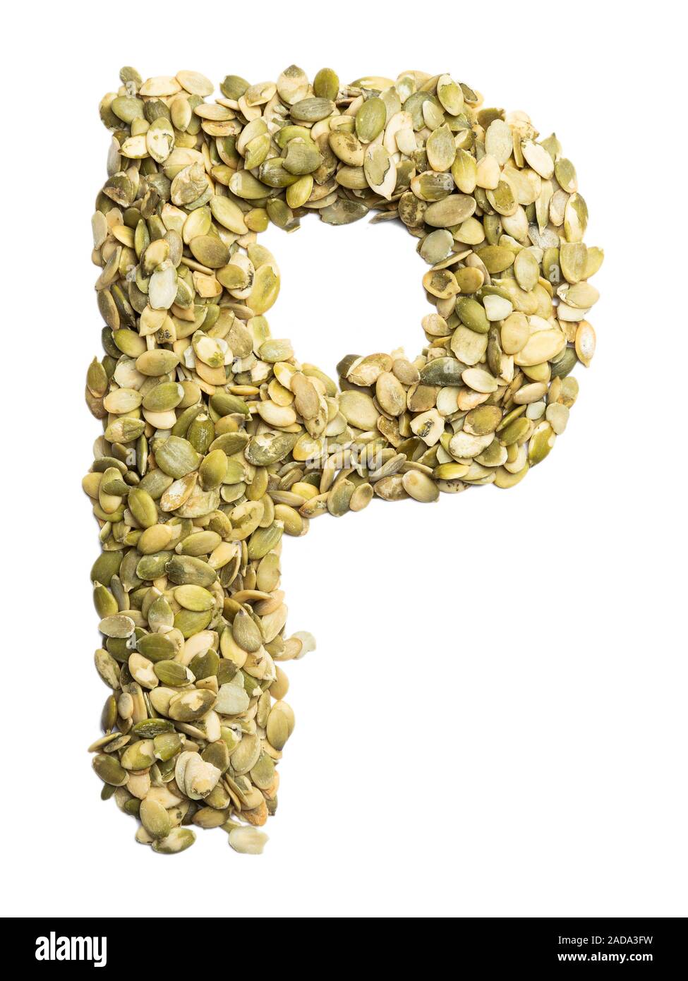 Letter P of the English alphabet from pumpkin seeds on a white isolated ...