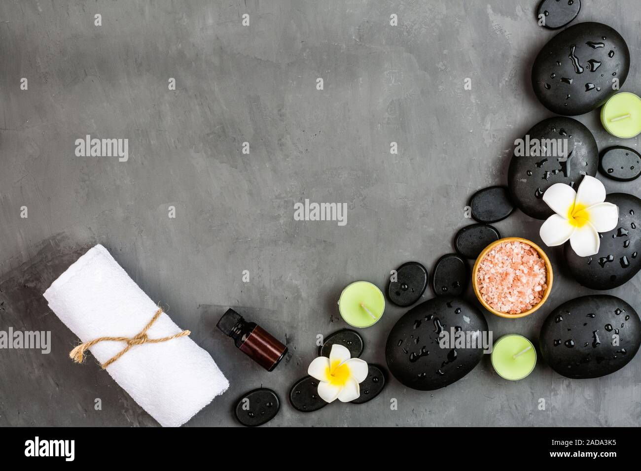 Top view of hot spa stones set for massage treatment and bamboo on ...