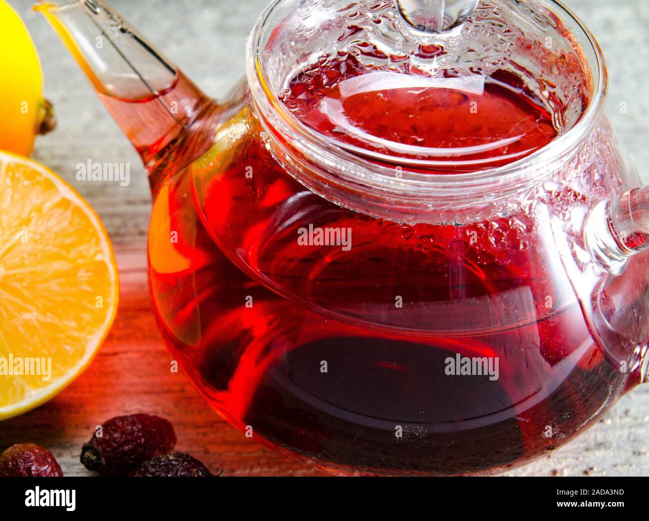 Fruit berry tea in the cup served on table Stock Photo - Alamy