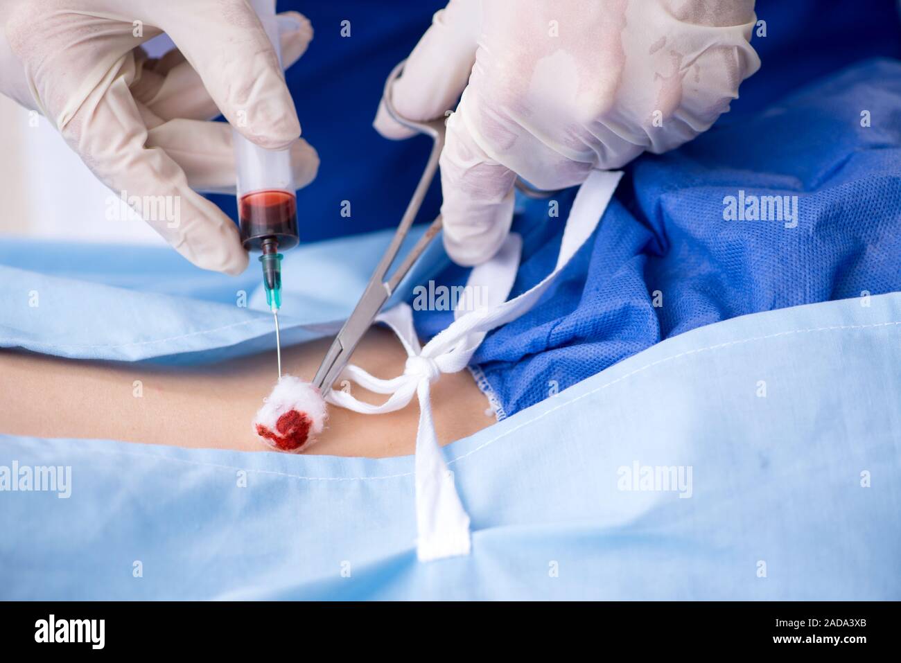 Female patient getting an injection in the clinic Stock Photo - Alamy