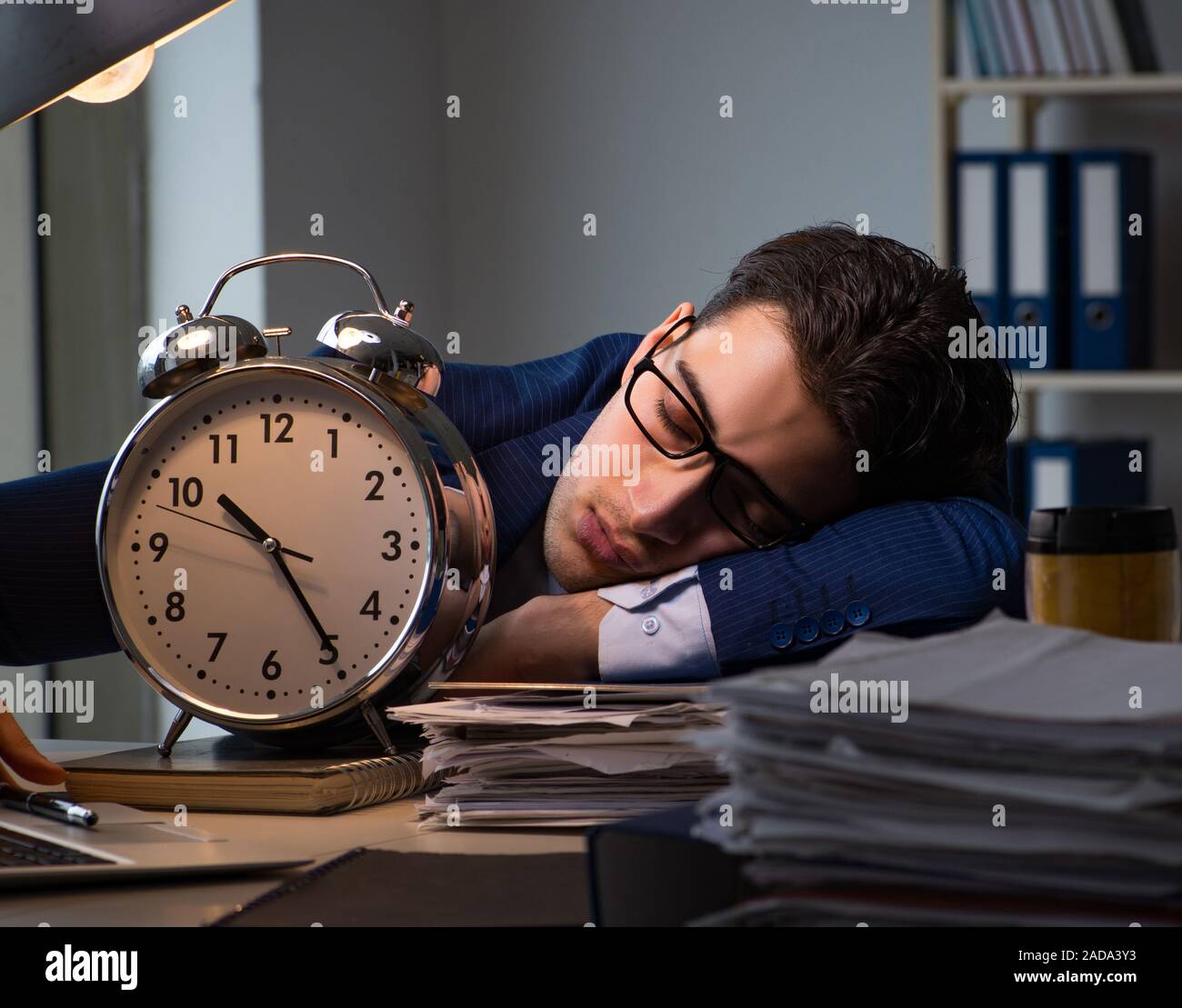 Businessman falling asleep during long hours in office Stock Photo - Alamy