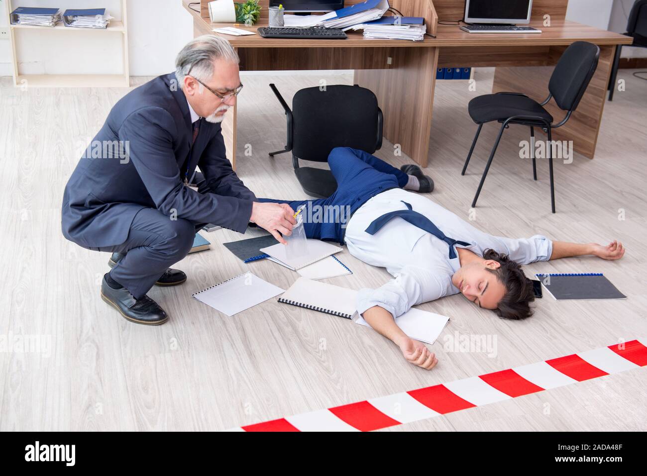 Forensic investigator and dead employee in the office Stock Photo - Alamy