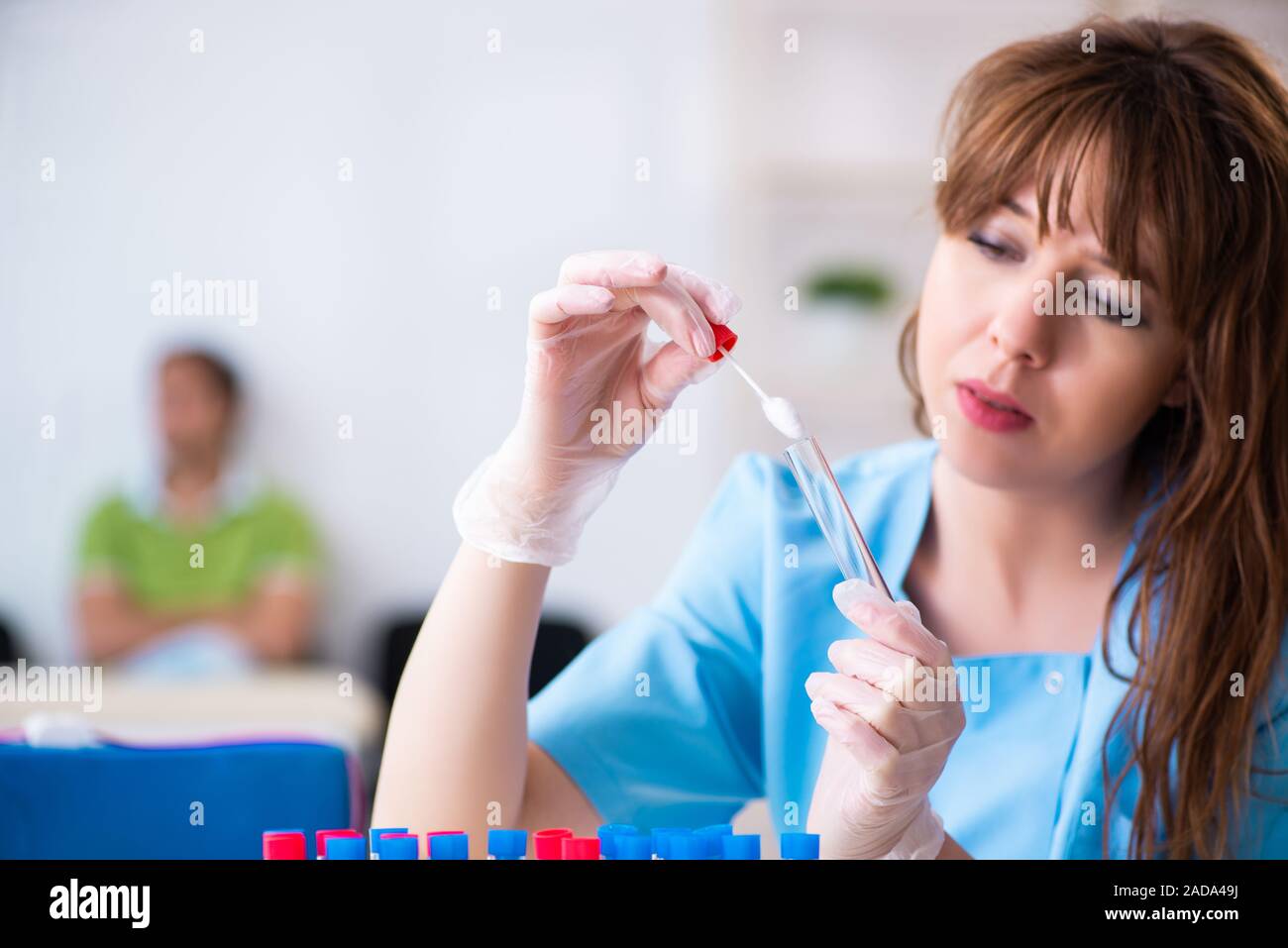 Young lab assistant testing blood samples in hospital Stock Photo - Alamy