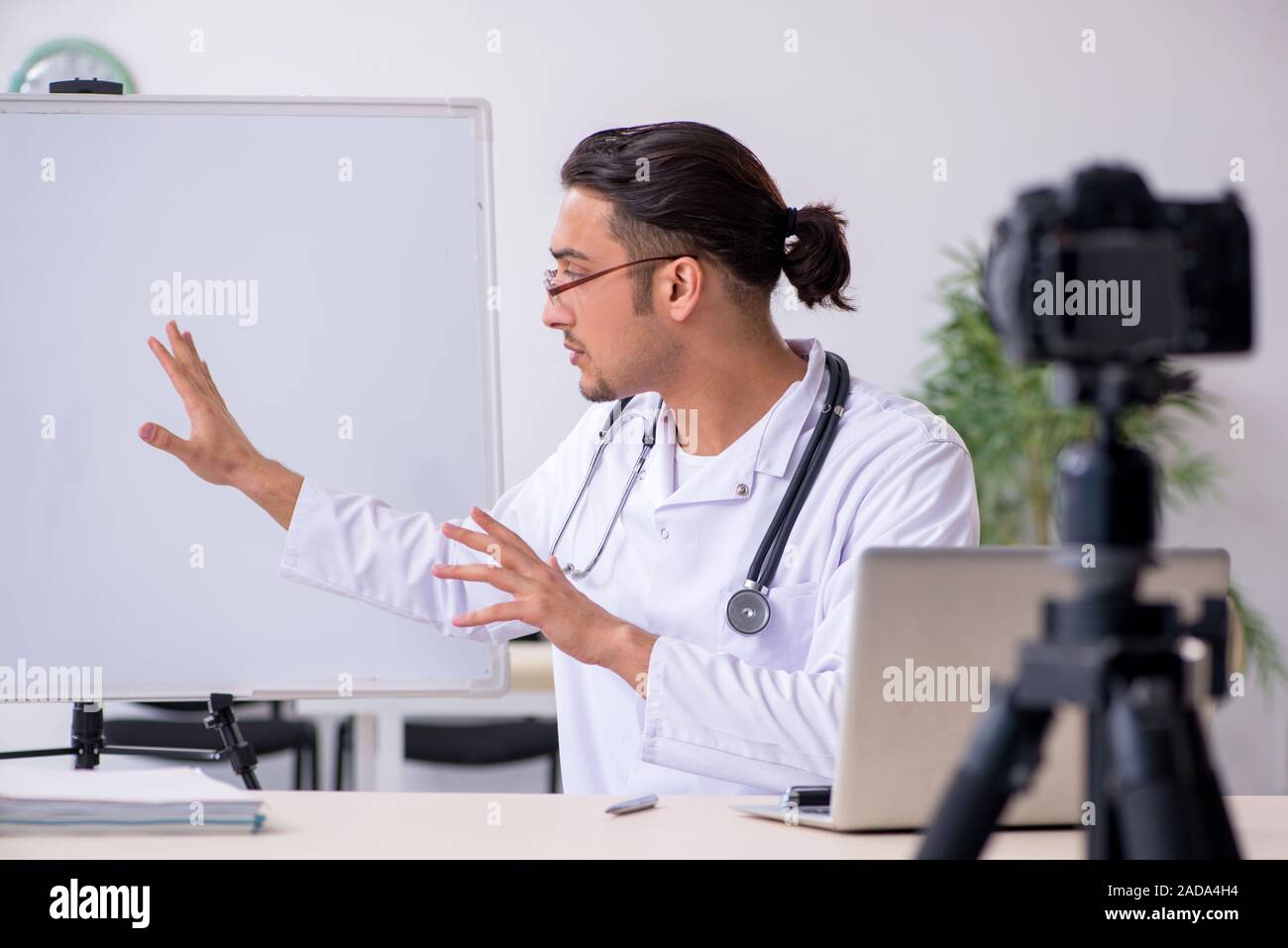 Male doctor blogger in white hi-res stock photography and images - Alamy