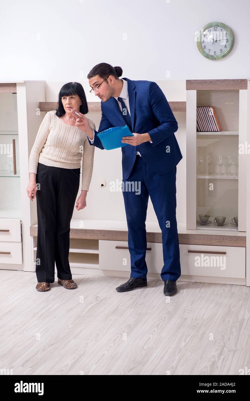 Male real estate agent and female client in the apartment Stock Photo ...