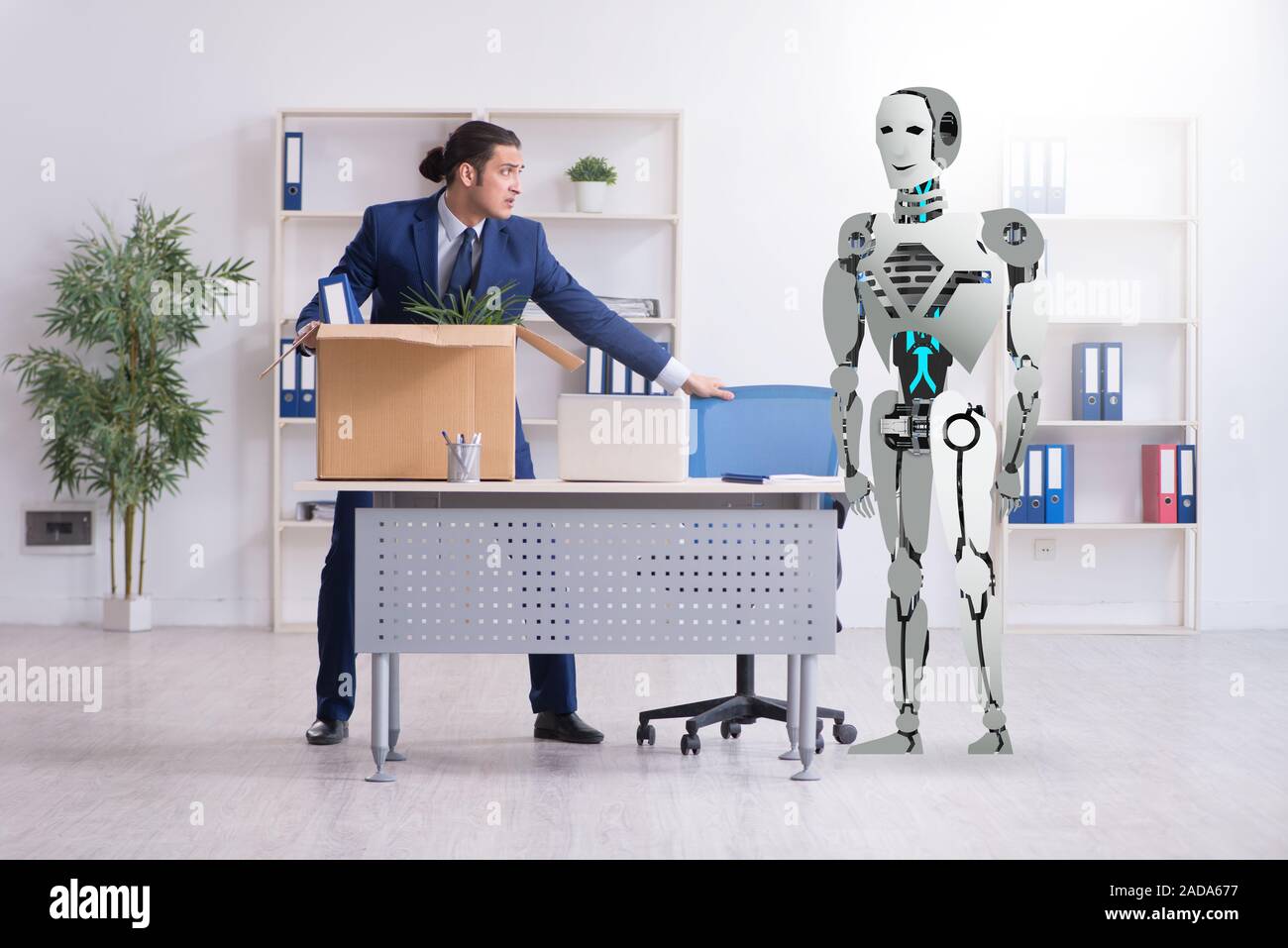 Concept of robots replacing humans in offices Stock Photo - Alamy
