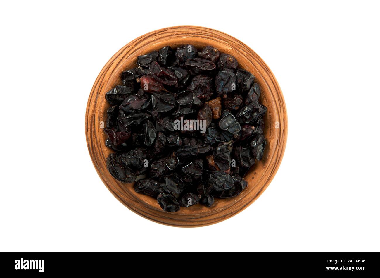 Dried barberry in a glossy cup isolated on a white background ...