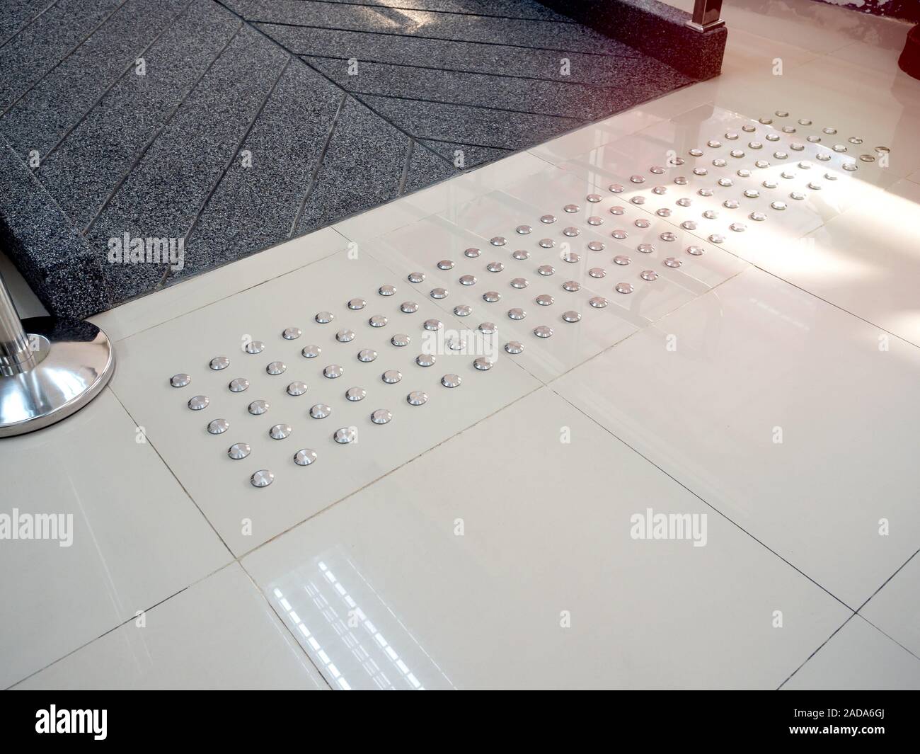Metallic dot tactile floor, blind path for blind people near the slope ...