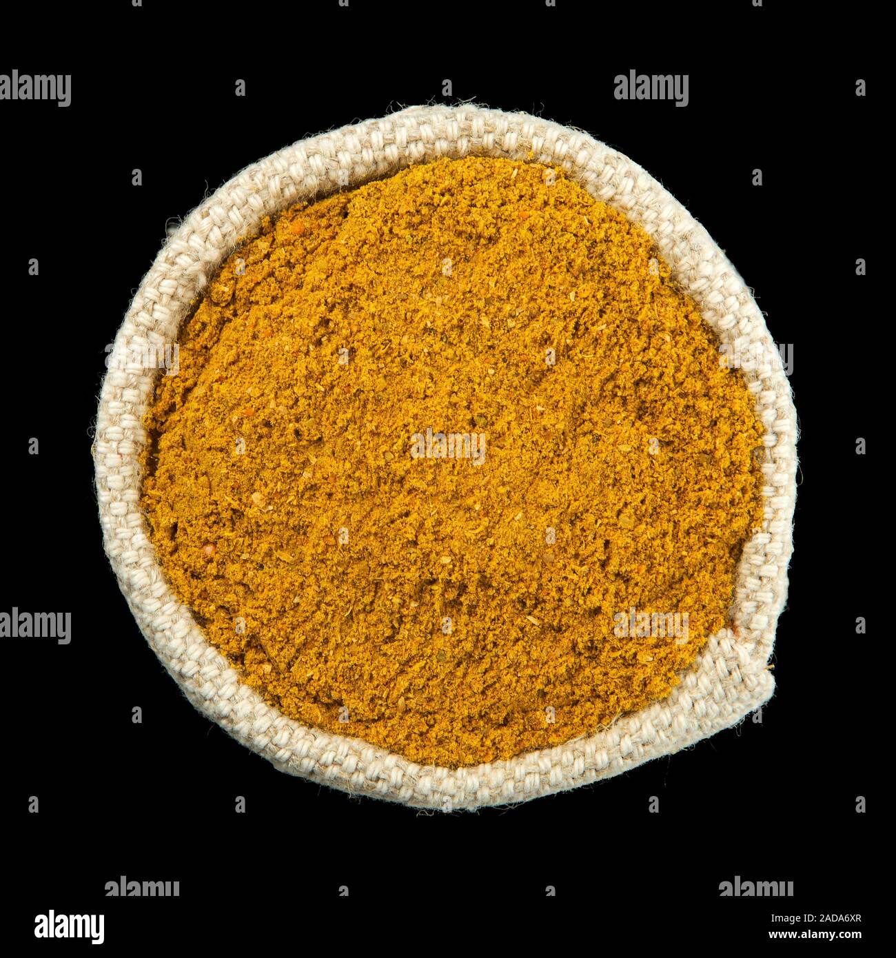 Curry in a bag isolated on a black background. Spice on isolate. View ...