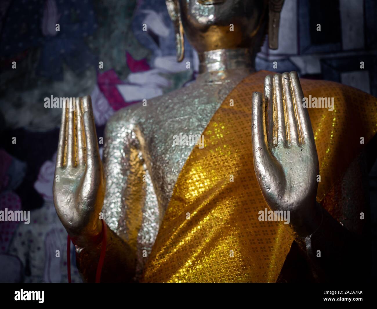 Close-up hands of buddha statue. The attitude of persuading the ...