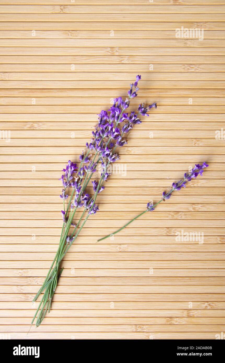 Lavender on wooden texture. Element of design Stock Photo - Alamy
