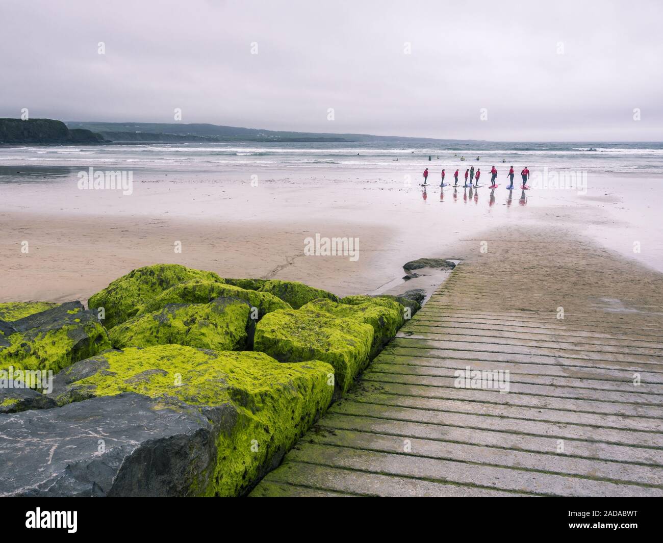 Sports activity surf school sand beach lahinch Stock Photo - Alamy