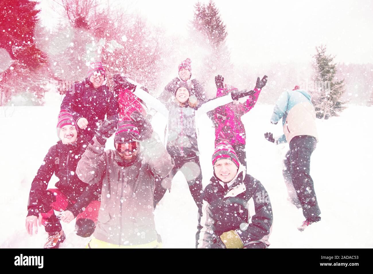 group of young people throwing snow in the air Stock Photo - Alamy