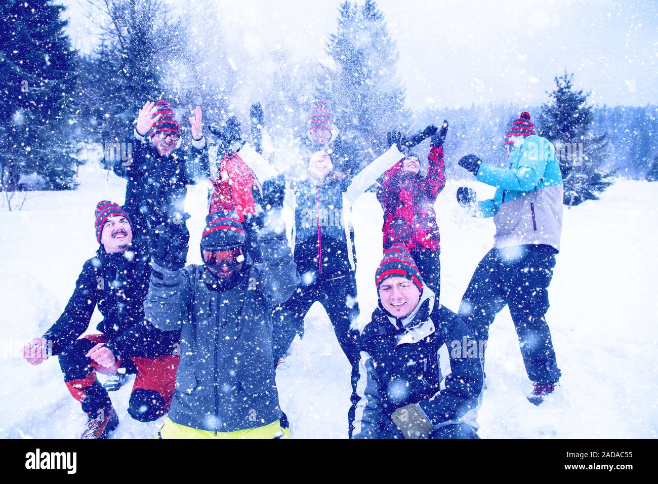 group of young people throwing snow in the air Stock Photo - Alamy