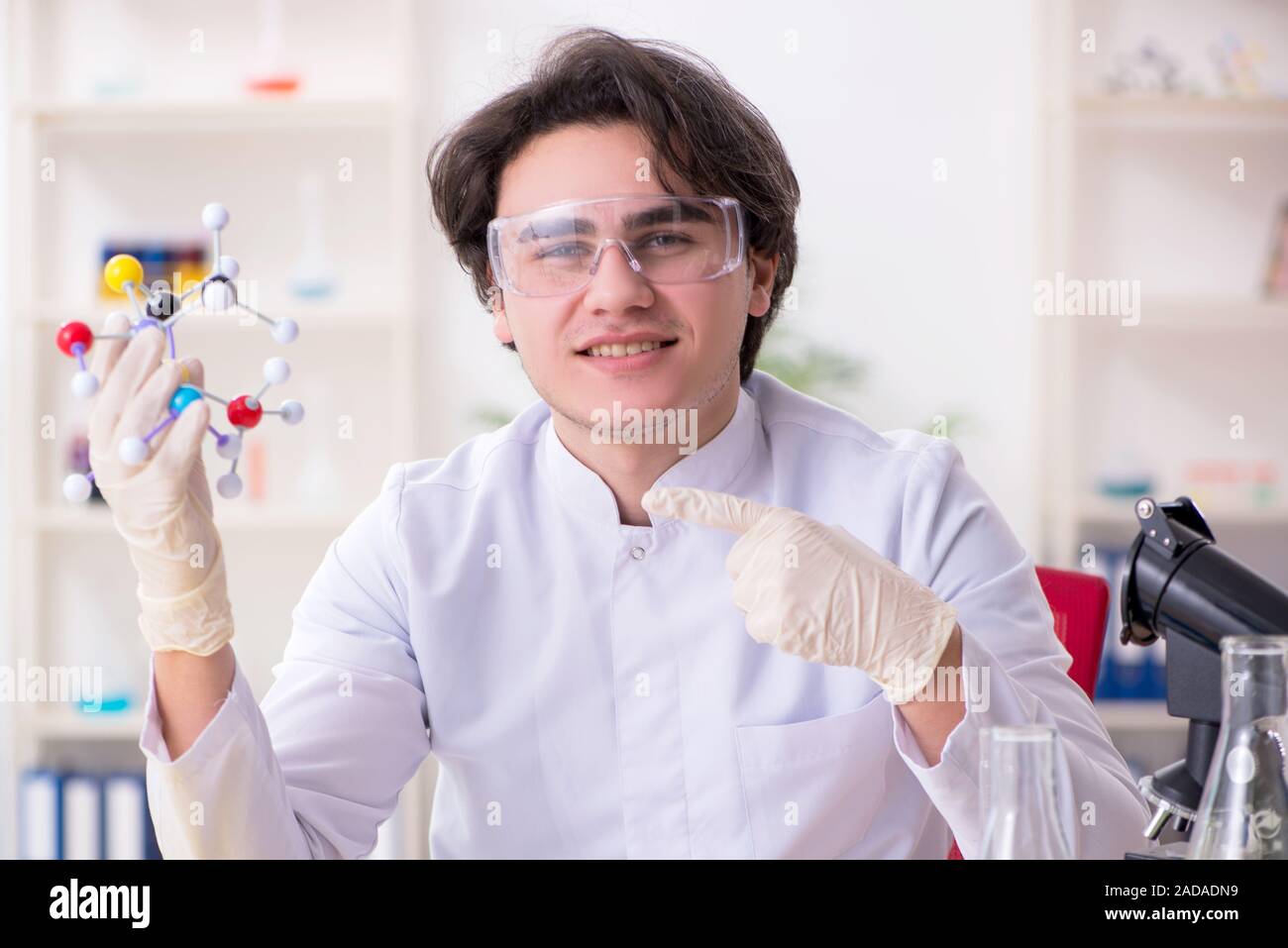 Young male biochemist working in the lab Stock Photo - Alamy