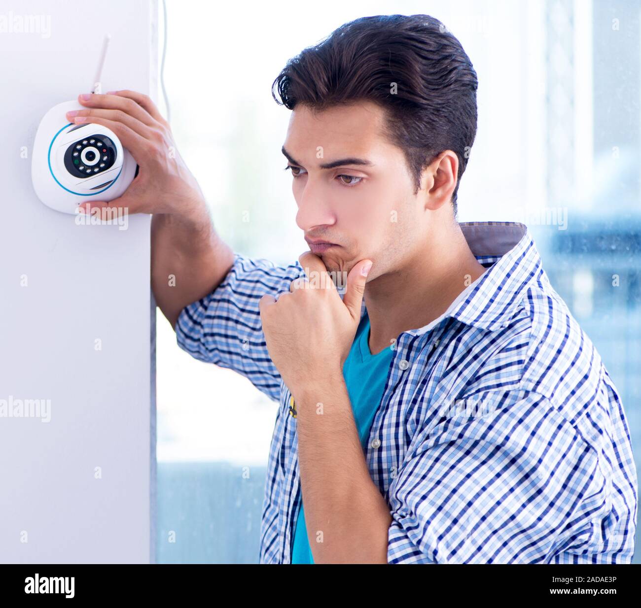 Man installing surveillance CCTV cameras at home Stock Photo - Alamy