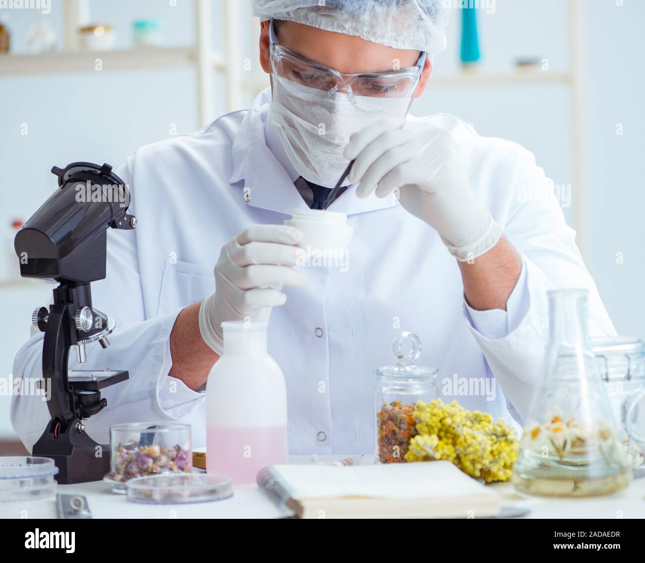 Chemist mixing perfumes in the lab Stock Photo - Alamy