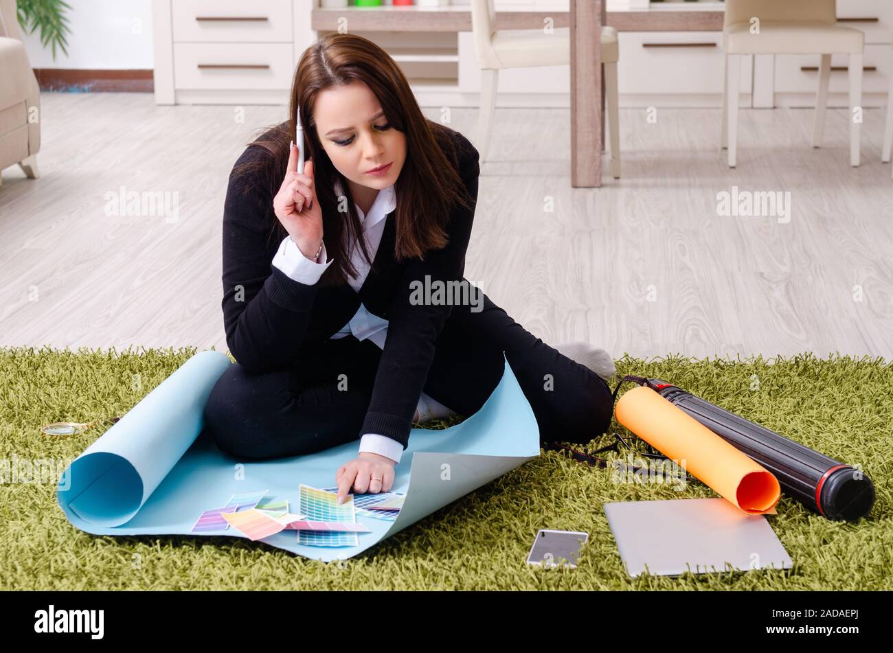 Female designer working in the office Stock Photo - Alamy
