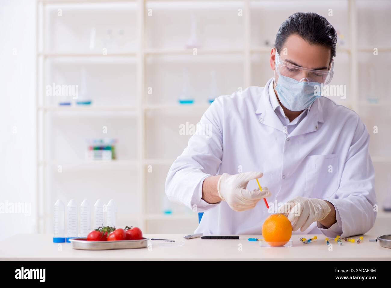 Male nutrition expert testing food products in lab Stock Photo - Alamy
