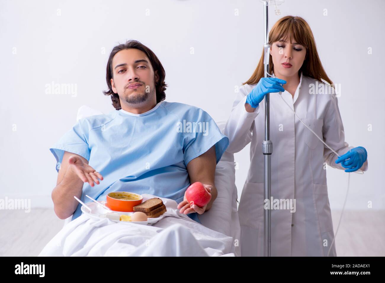 Male patient eating food in the hospital Stock Photo - Alamy