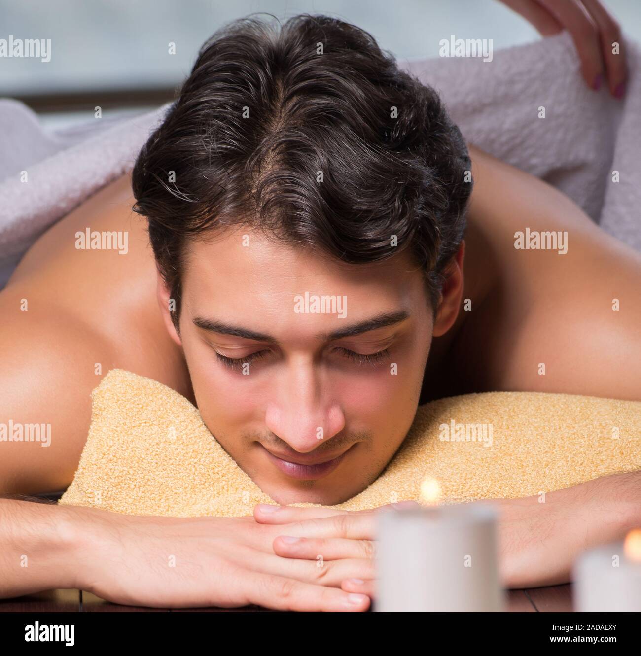 Young handsome man during spa procedure Stock Photo - Alamy