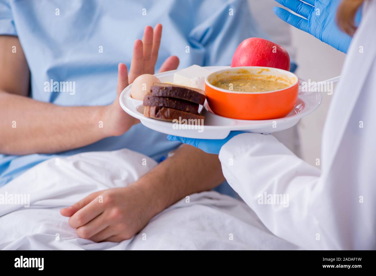 Male patient eating food in the hospital Stock Photo - Alamy