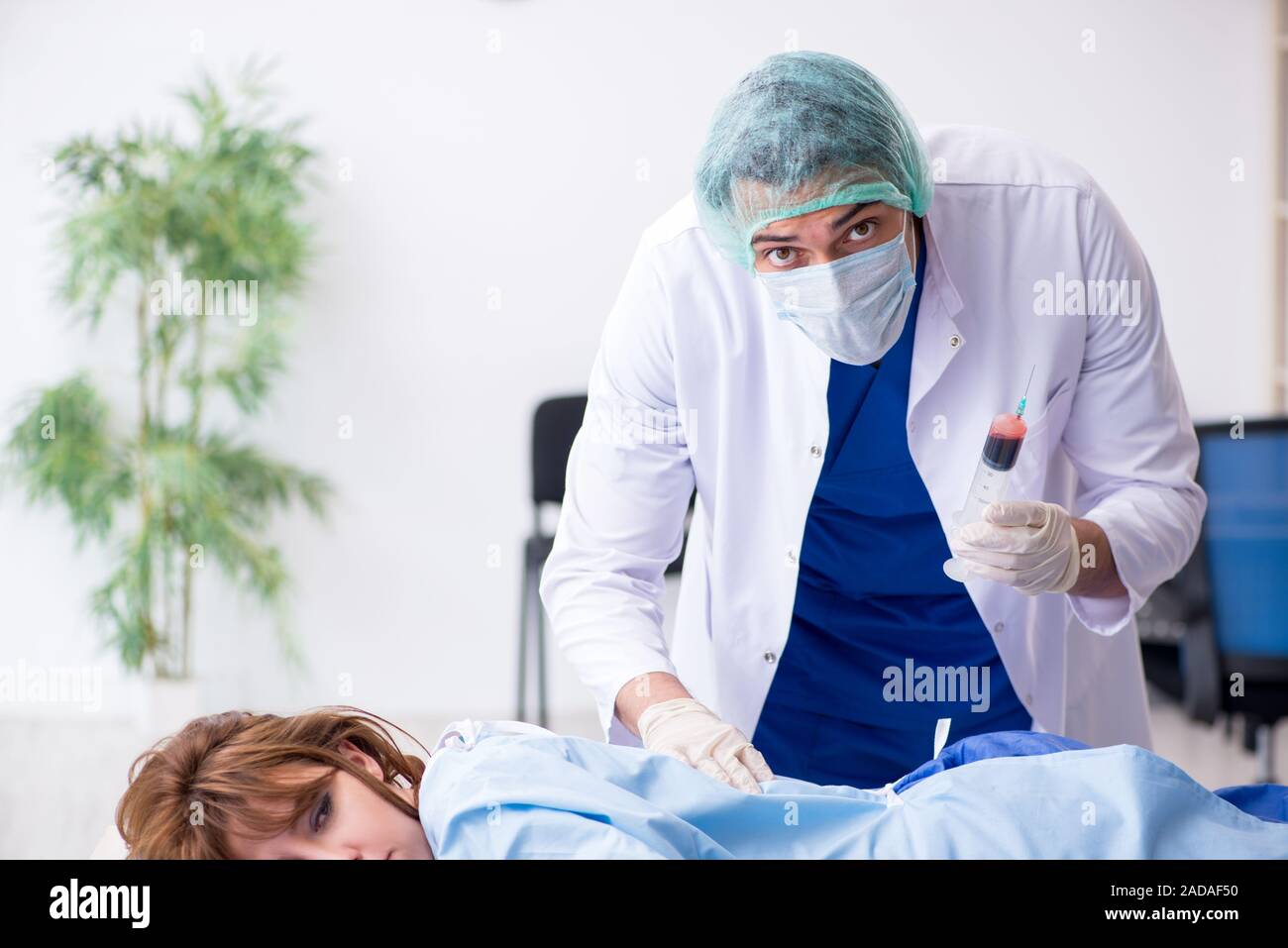 Female patient getting an injection in the clinic Stock Photo - Alamy
