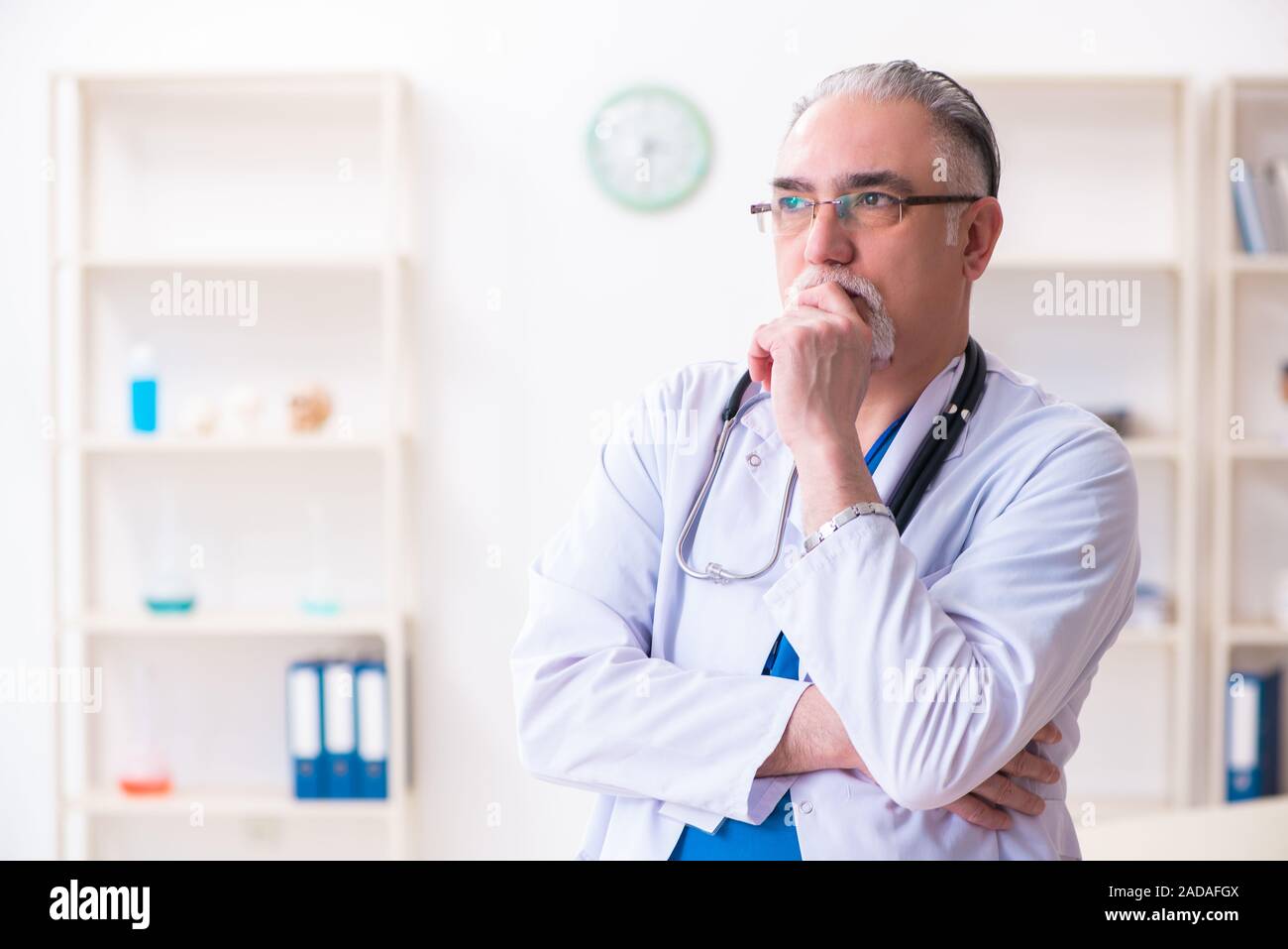 Focused senior old doctor working hi-res stock photography and images ...