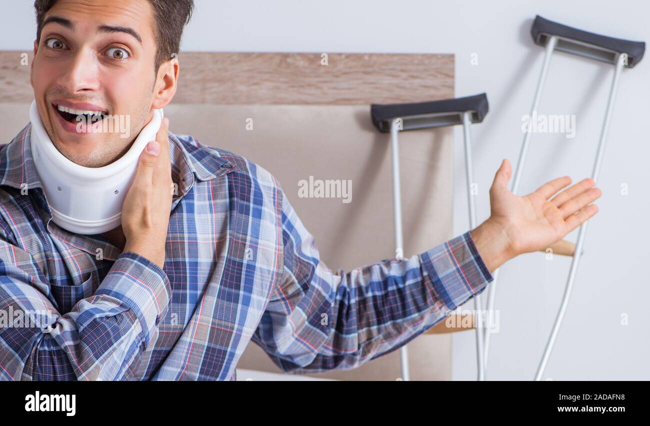 Injured man in bed at home with crutches hi-res stock photography and ...