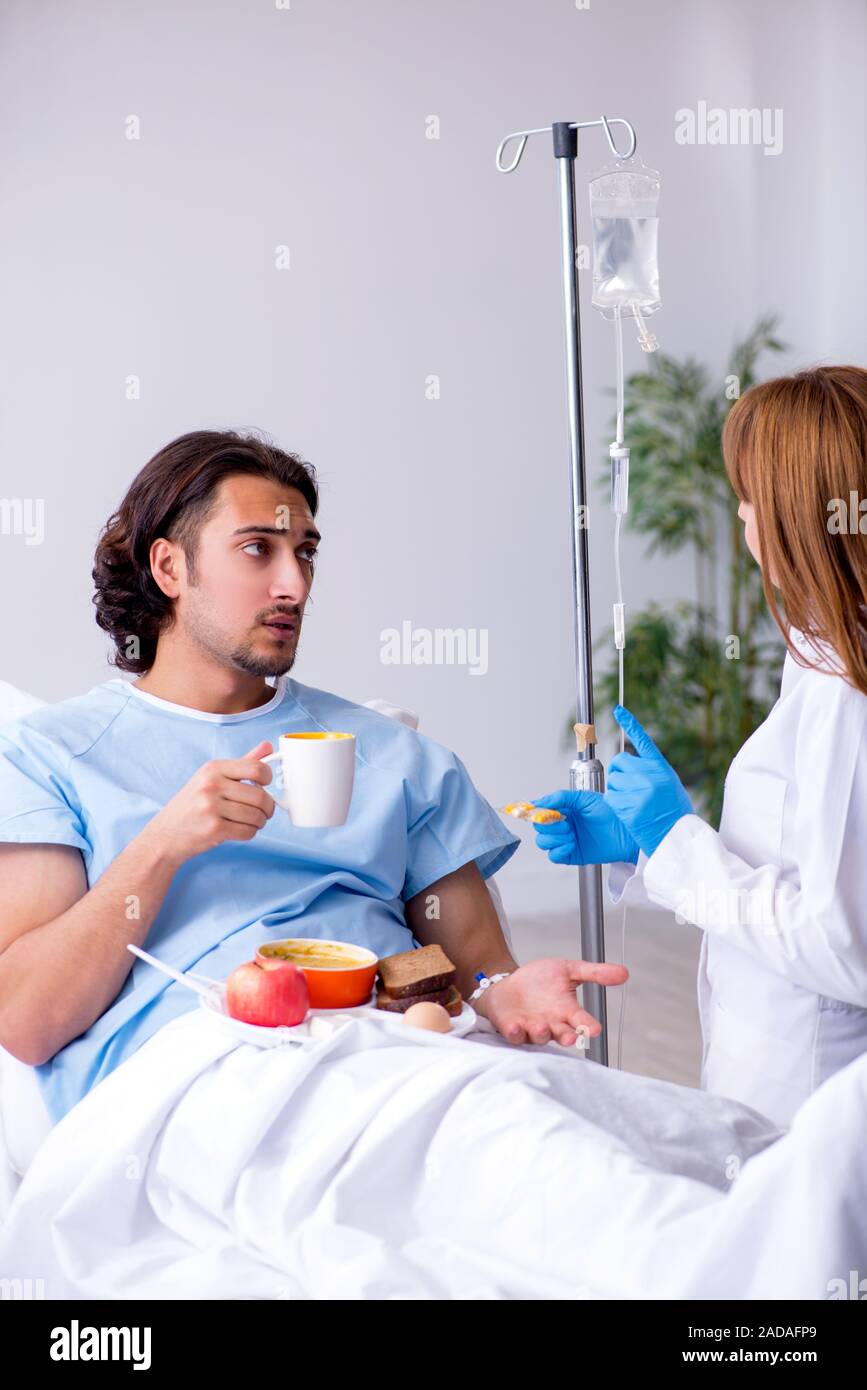 Male patient eating food in the hospital Stock Photo - Alamy