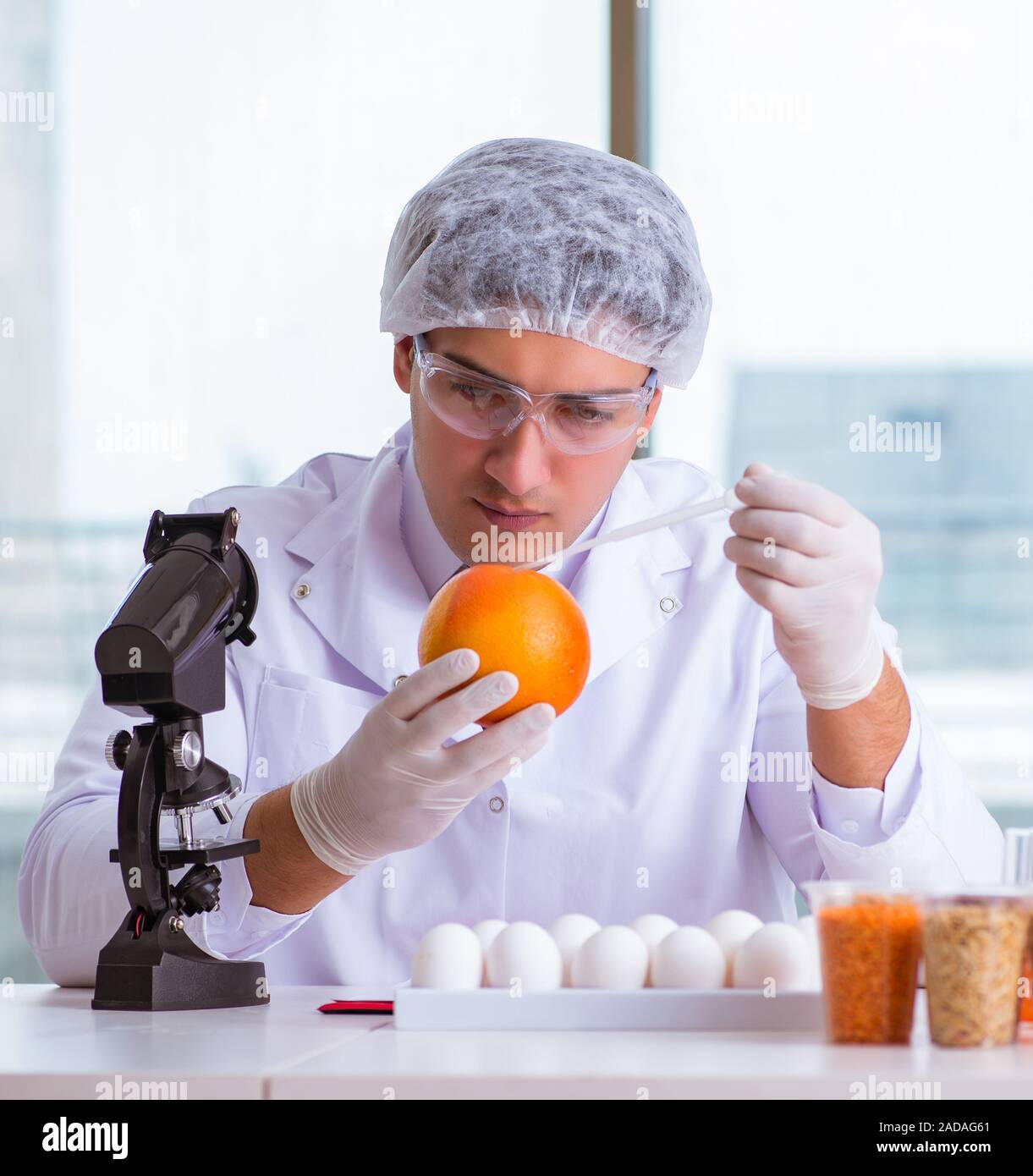 Nutrition expert testing food products in lab Stock Photo - Alamy