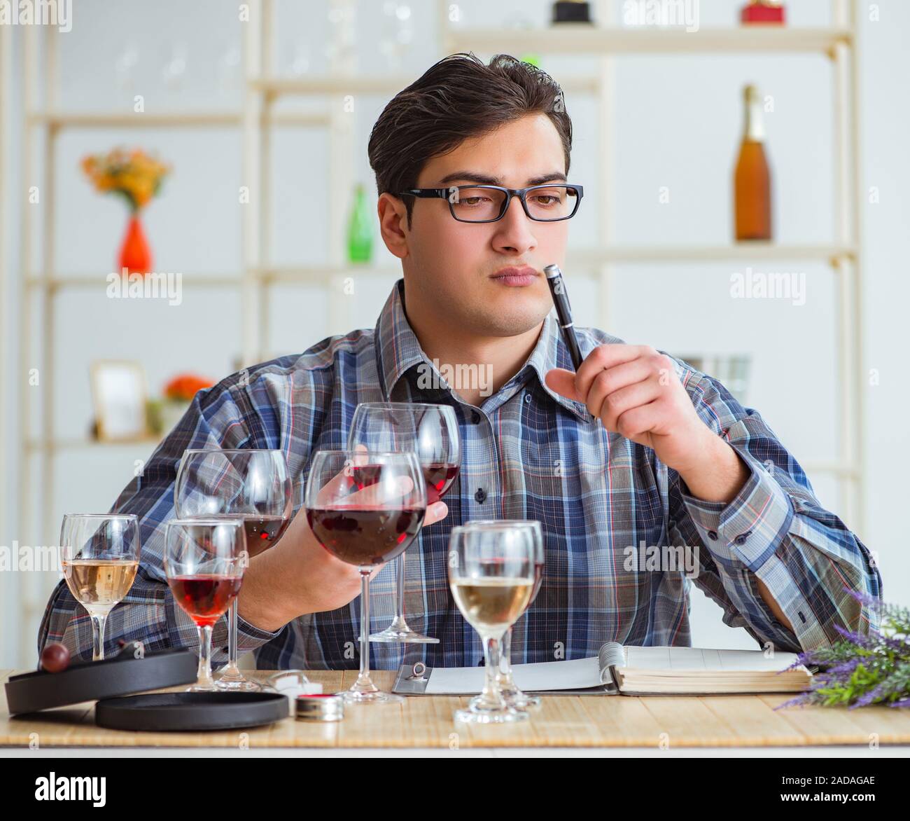 Sommelier examining wine bottle hi-res stock photography and images - Alamy