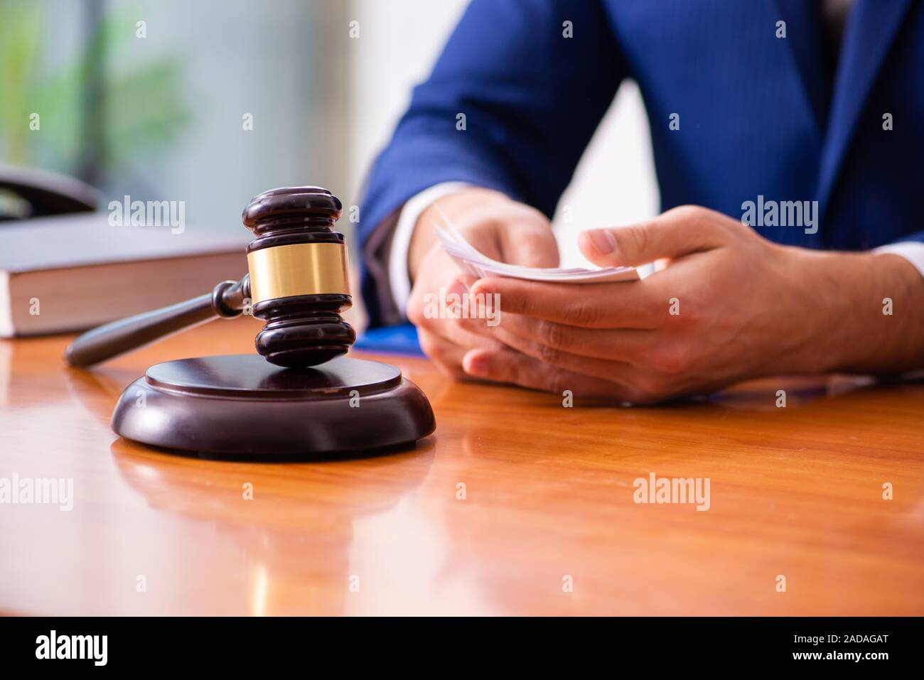 Young male judge sitting in courtroom Stock Photo - Alamy