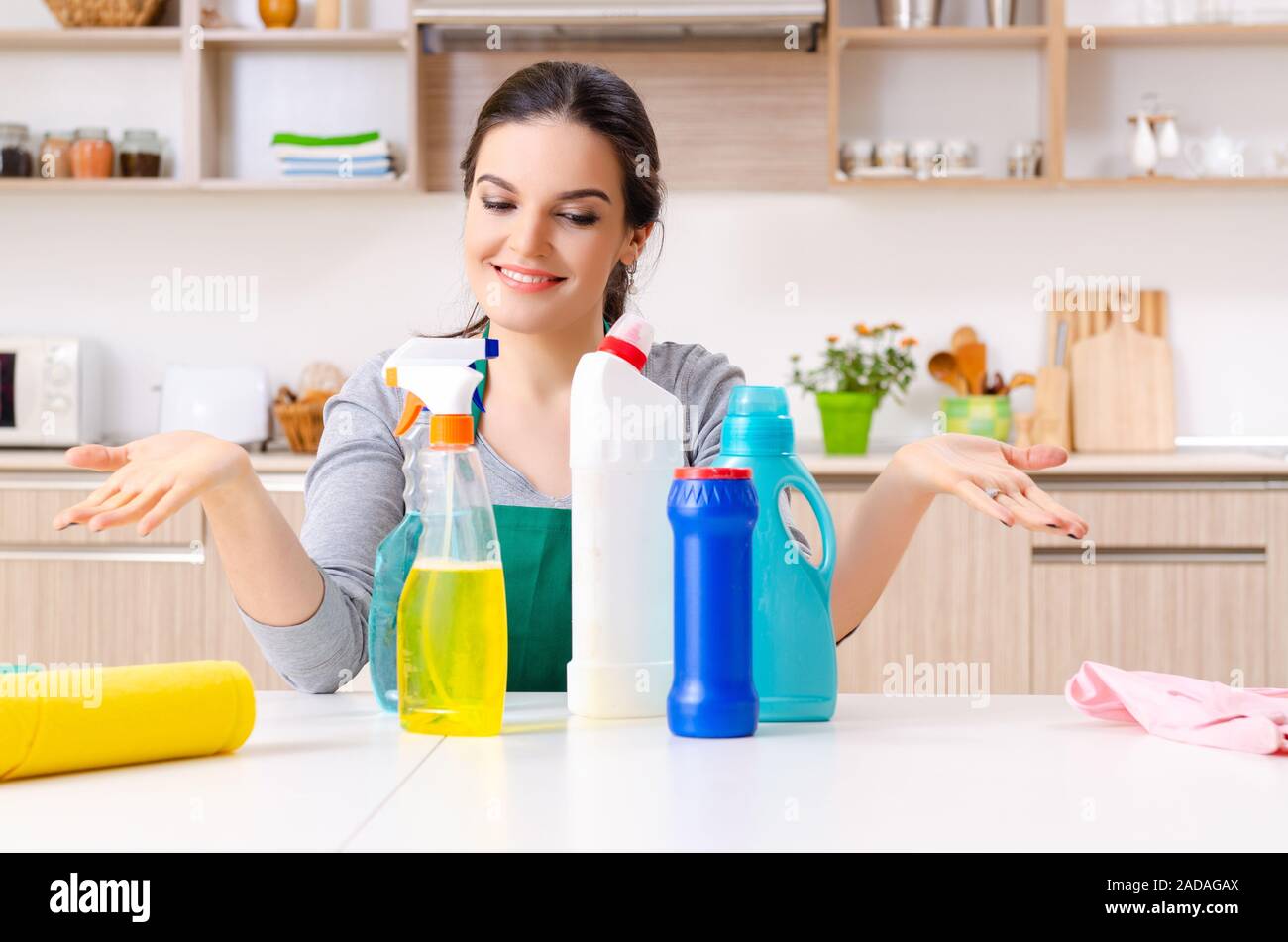 Young female contractor doing housework Stock Photo - Alamy