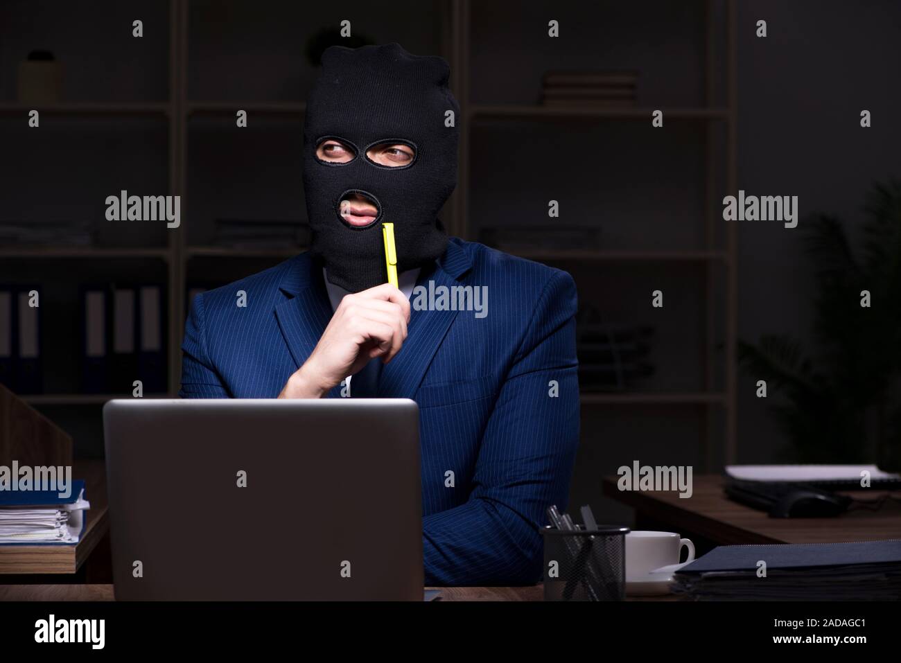 Male employee stealing information in the office night time Stock Photo ...