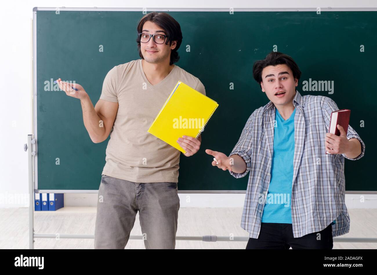 Two male students in the classroom Stock Photo - Alamy