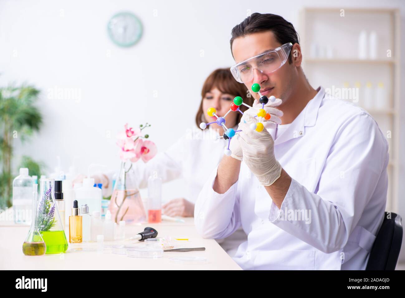 Two chemists working in the lab Stock Photo - Alamy