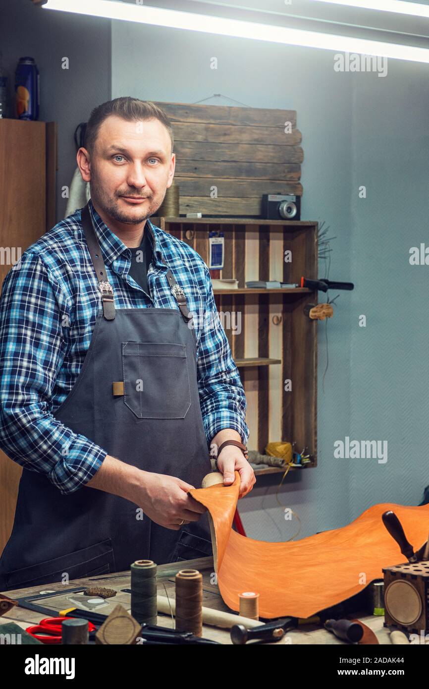 Concept of handmade craft production of leather goods Stock Photo - Alamy