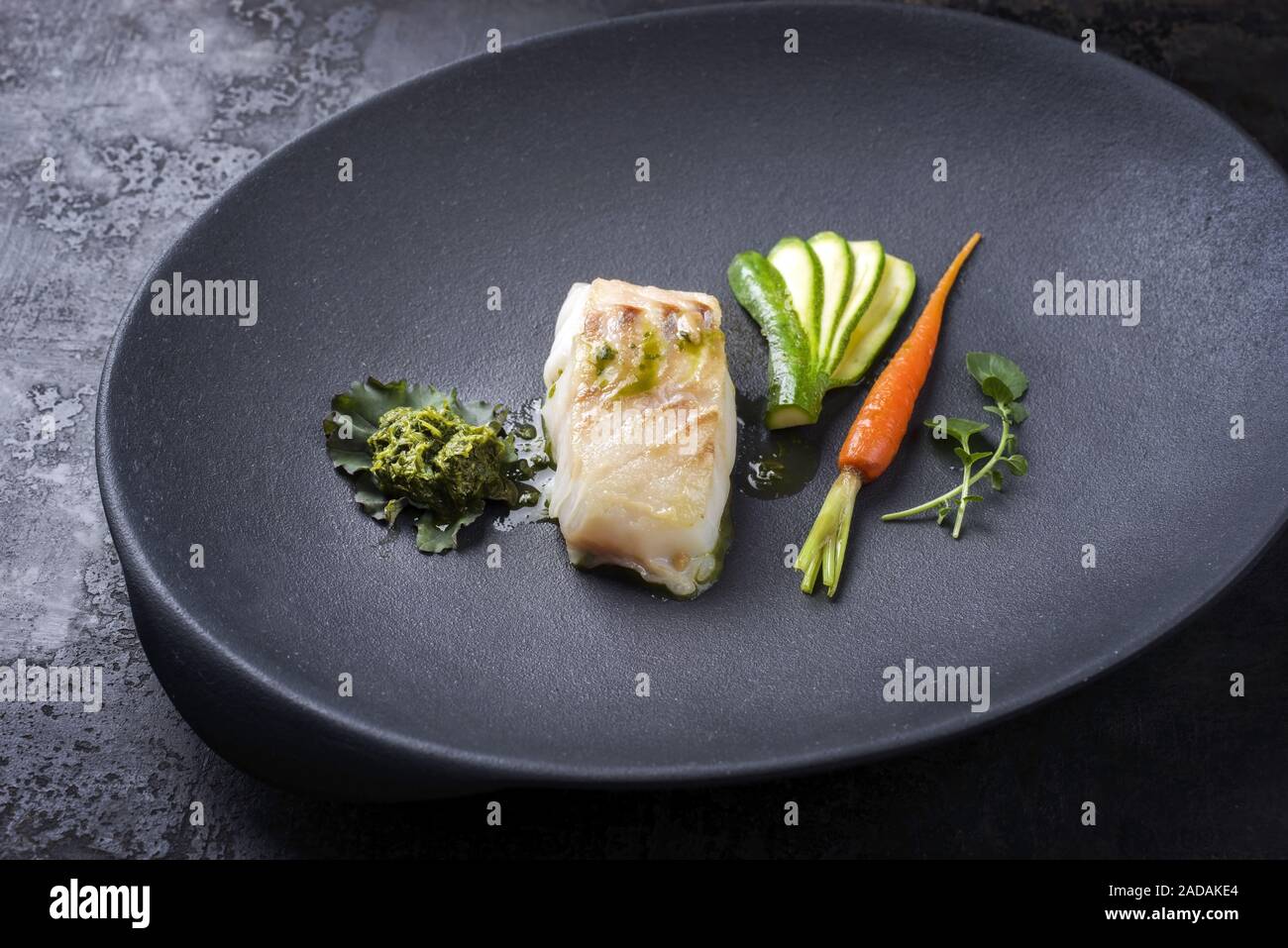 Fried Danish skrei cod fish filet with vegetable Stock Photo - Alamy
