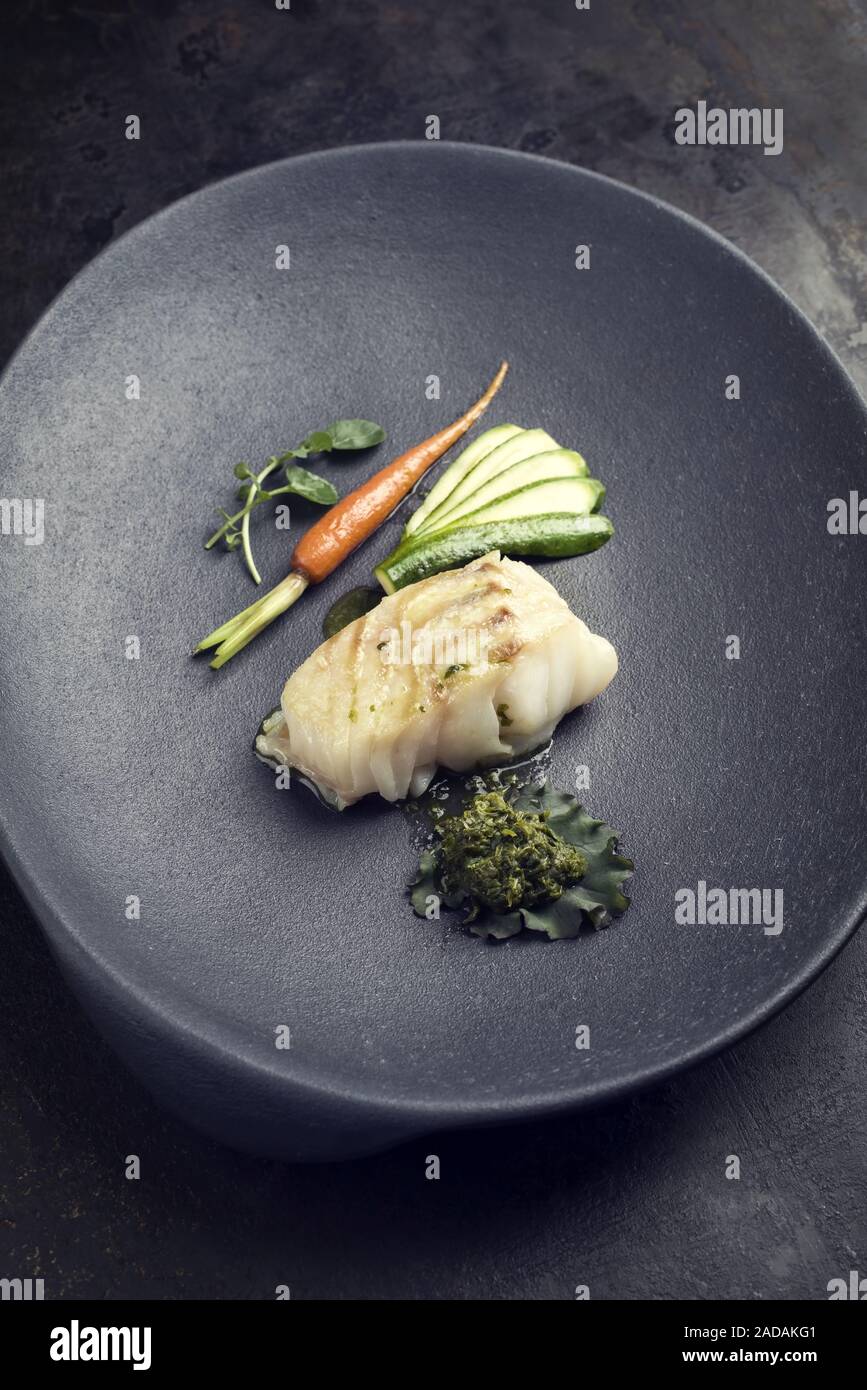 Fried Danish skrei cod fish filet with vegetable Stock Photo - Alamy