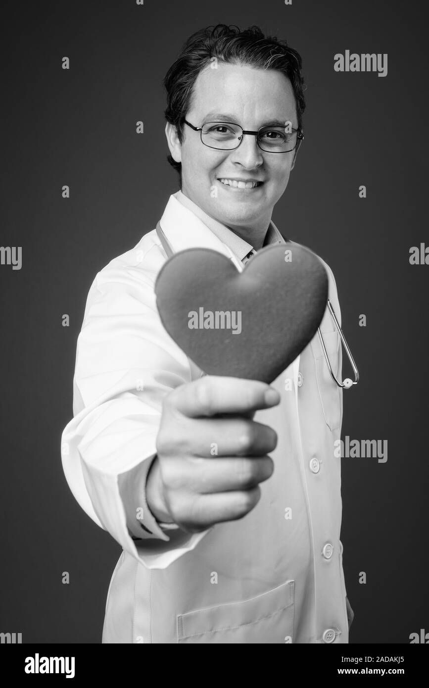 Studio shot of Italian man doctor in black and white Stock Photo - Alamy